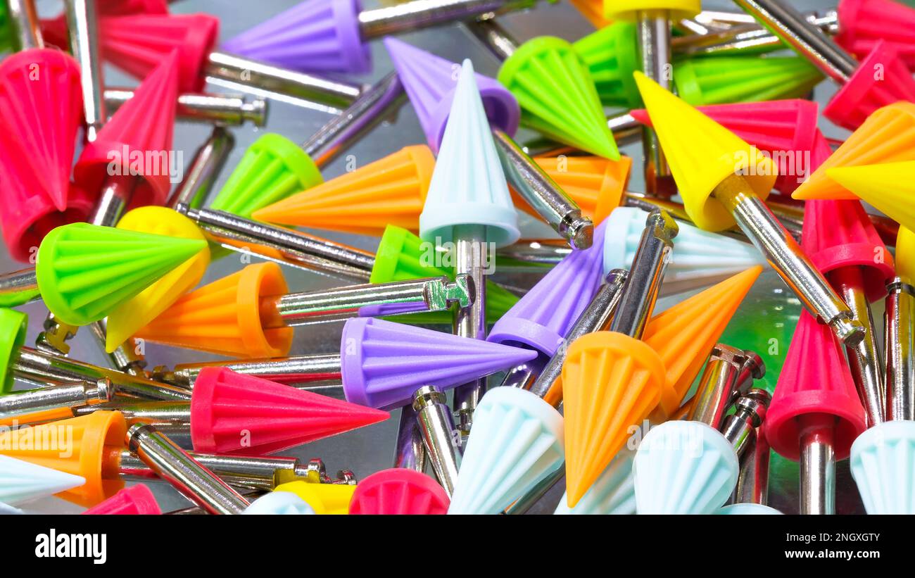 Many dental tools drills different colors close-up, dentistry concept ...