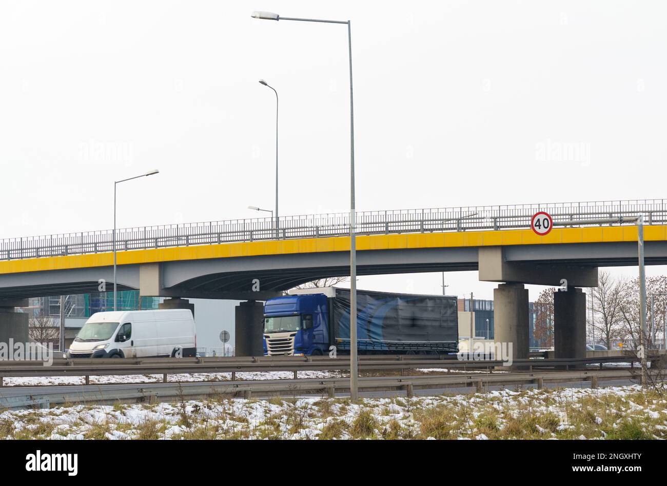 Trucks drive under the transport bridge. Transport logistics Stock ...