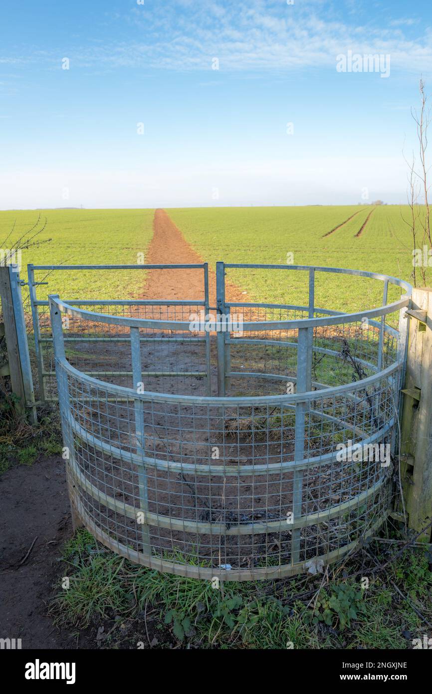 Galvanised steel cylinder Kissing gate leading to a public footpath ...