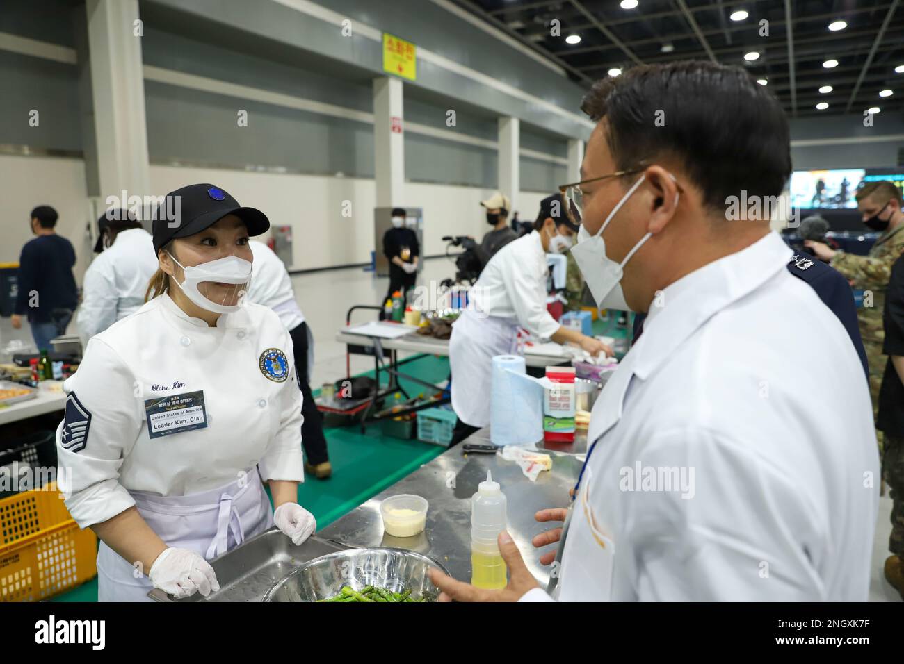 A U.S. service member discusses her team’s cooking tactics with a judge ...