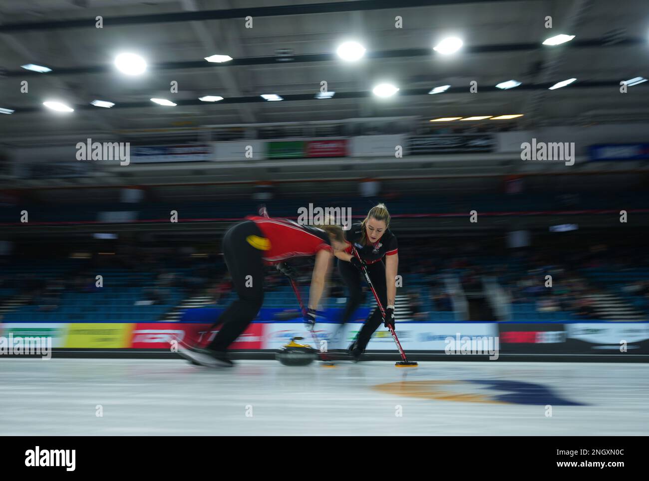Ontario second Emma Miskew, right, and lead Sarah Wilkes sweep while ...