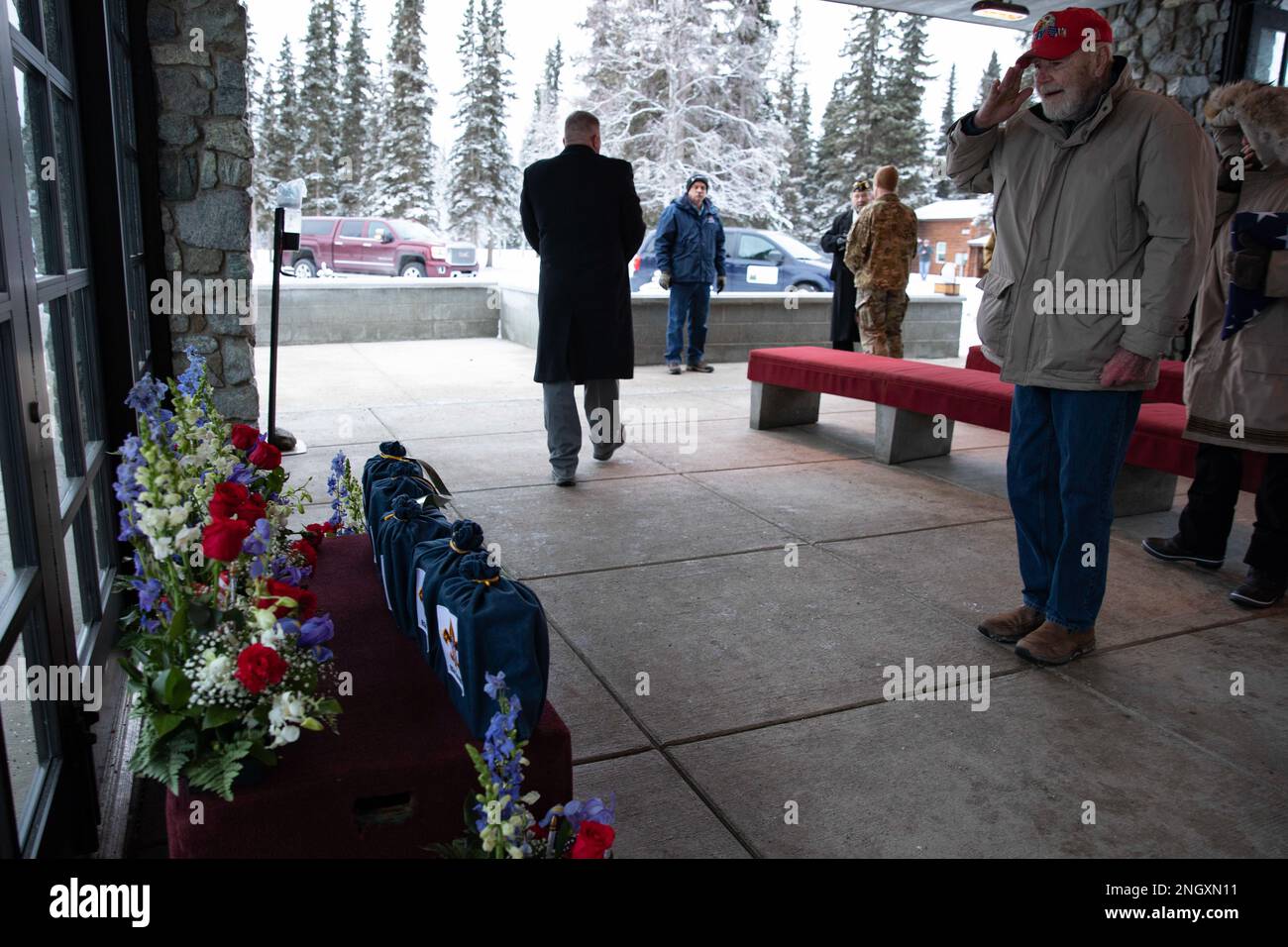 A U.S. Army veteran renders a salute to the remains of five veterans ...