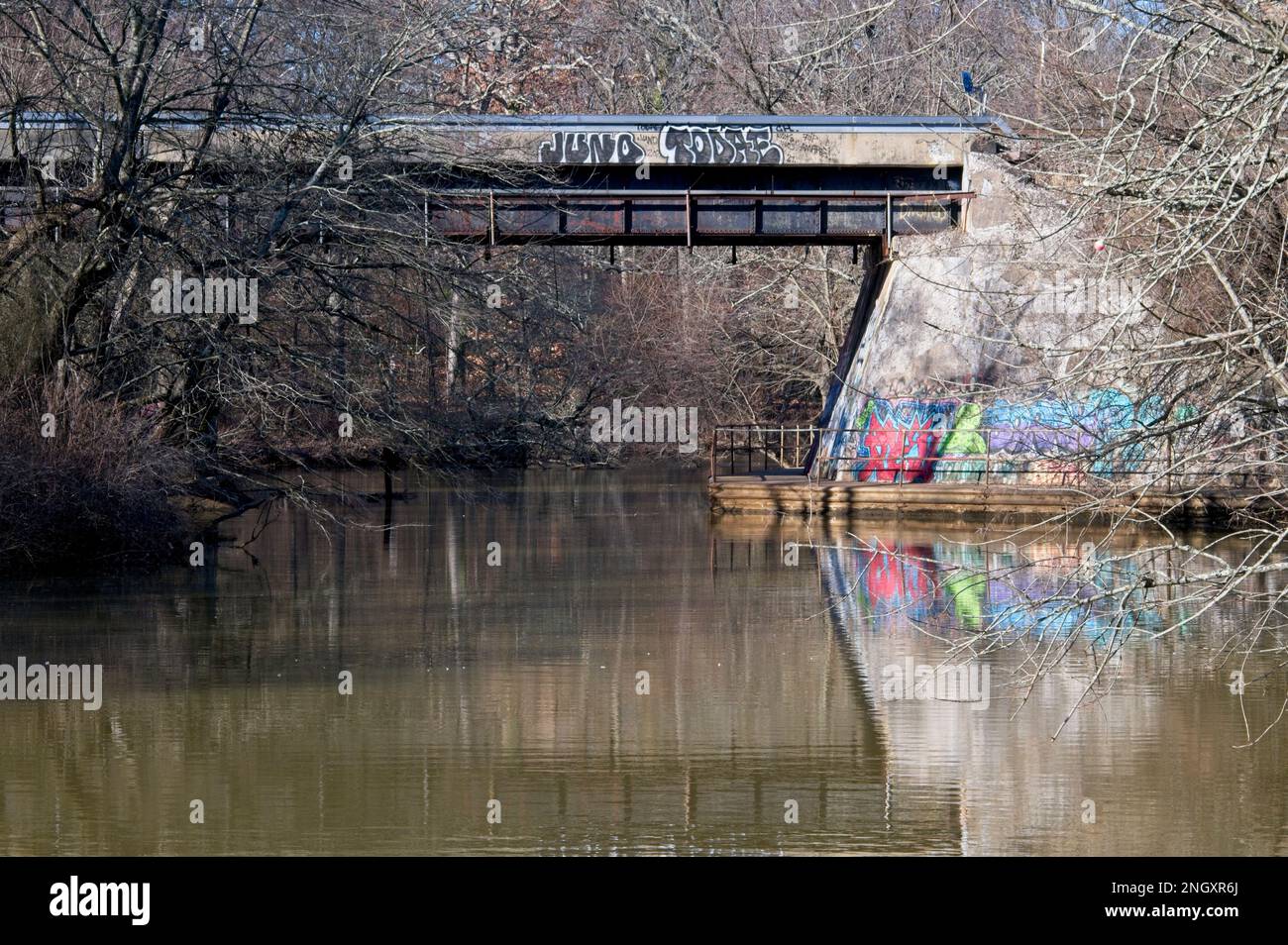 Graffiti on a train tresses bridge over the Cooper river and bike path ...