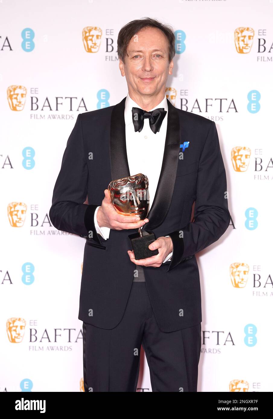 Volker Bertelmann poses with the award for Original Score Award for All ...