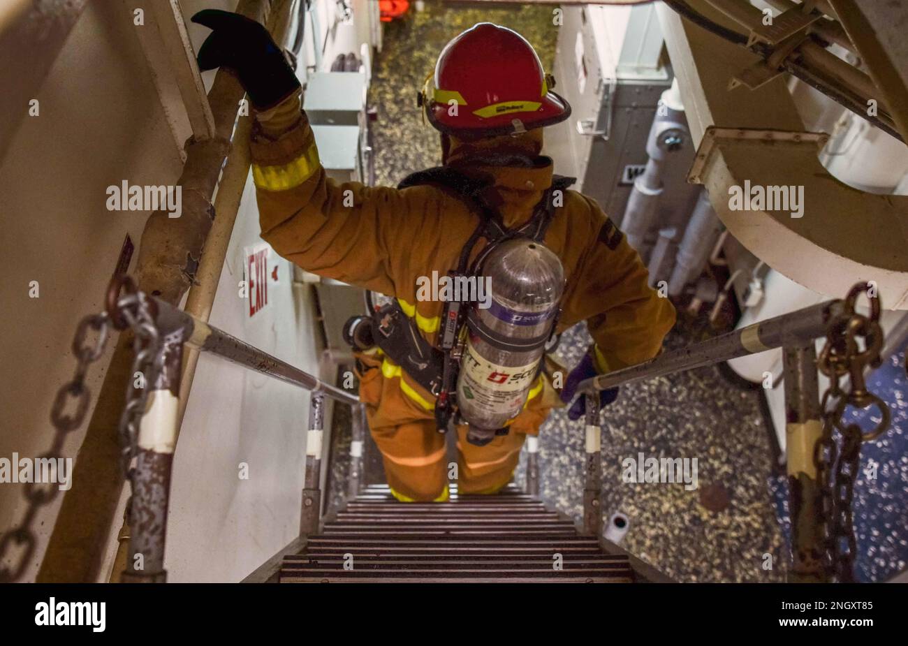 221130-N-RT917-1005 ARABIAN GULF (Nov. 30, 2022) A Sailor descends a ...
