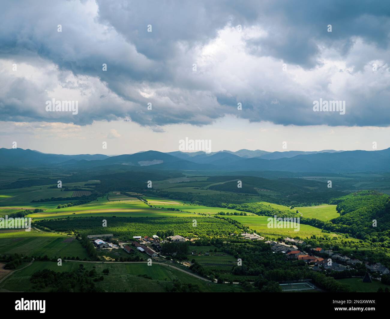 Aerial view of rural eastern european landscape with hills village and ...
