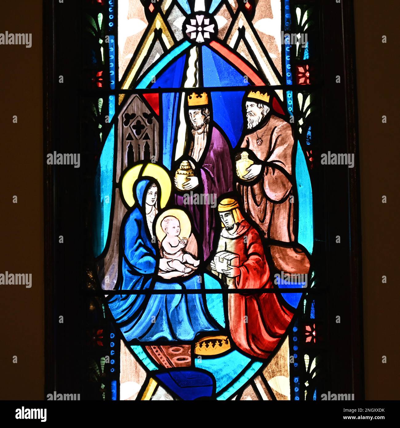 Stain glass church window with the three wise men at the birth of Jesus ...