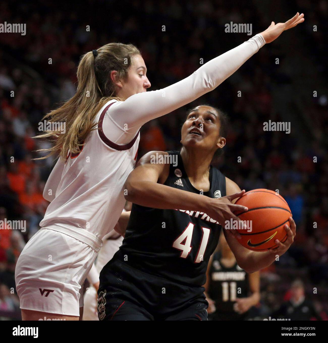 North Carolina State's Camille Hobby, right, looks to shoot while ...