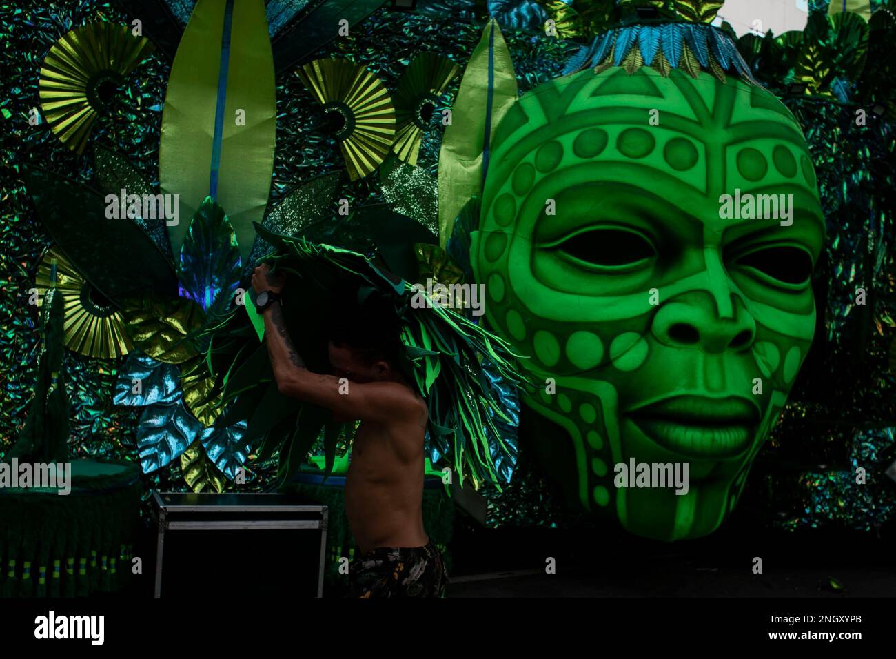 A man works on a float before the samba school parade during Carnival ...