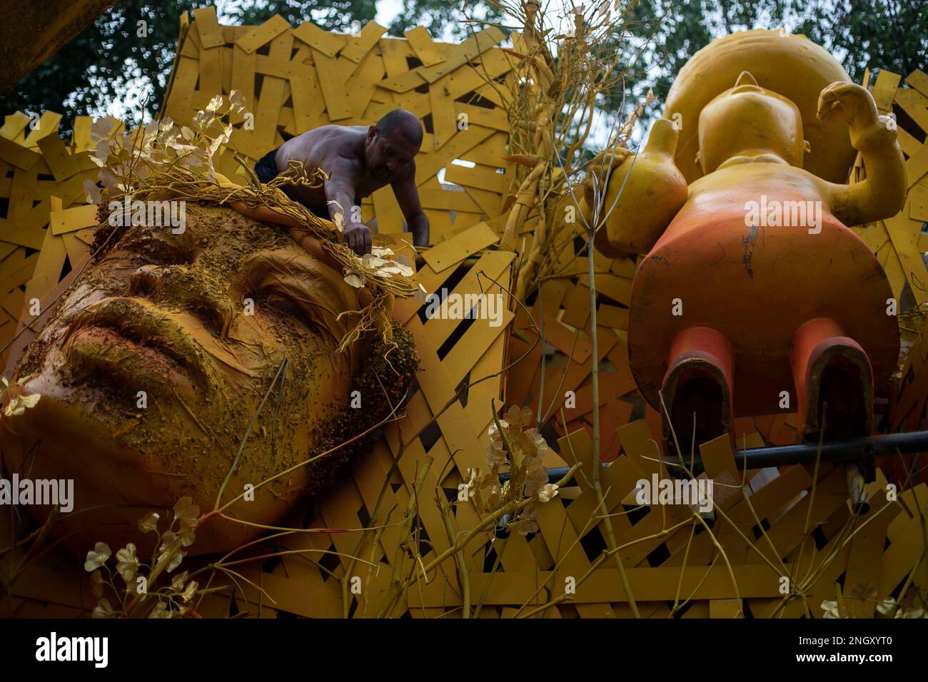 A man works on a float before the samba school parade during Carnival ...