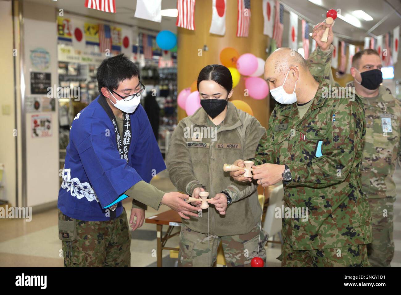 Members of the Yama Sakura exercise receive ken-damas, traditional Japanese toys, during the ...