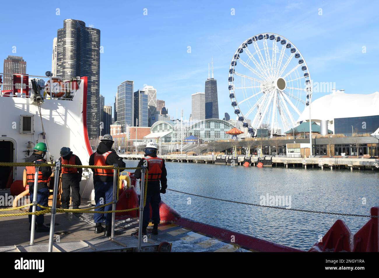Crewmembers onboard USCGC Mackinaw (WLBB 30) man the starboard side of ...