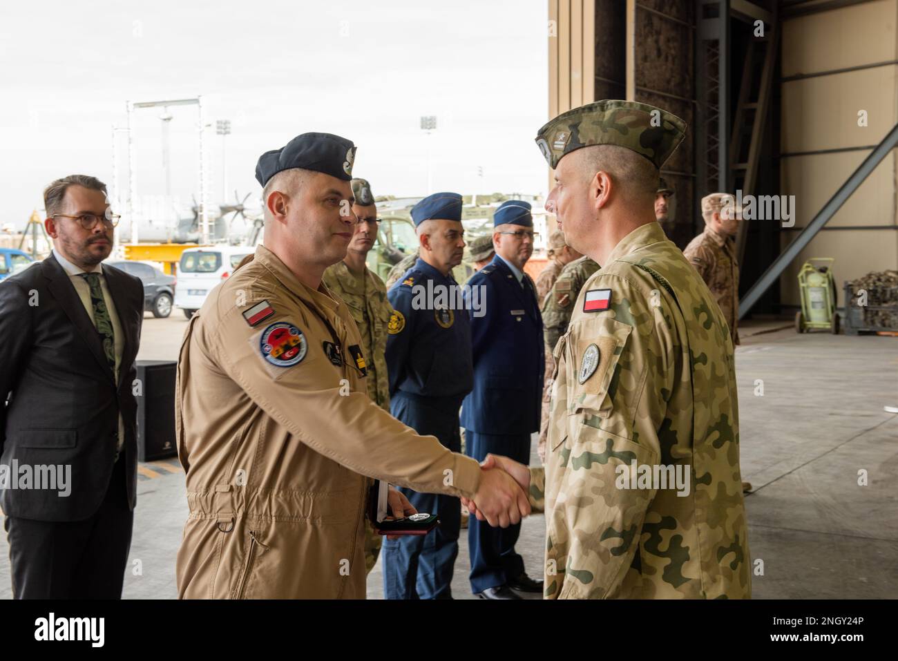 Polish Navy Lt. Cdr. Tomasz Kozłowski, left, outgoing commander of the ...