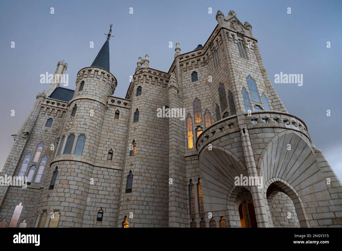 The Episcopal Palace is illuminated as storm clouds gather in Astorga ...