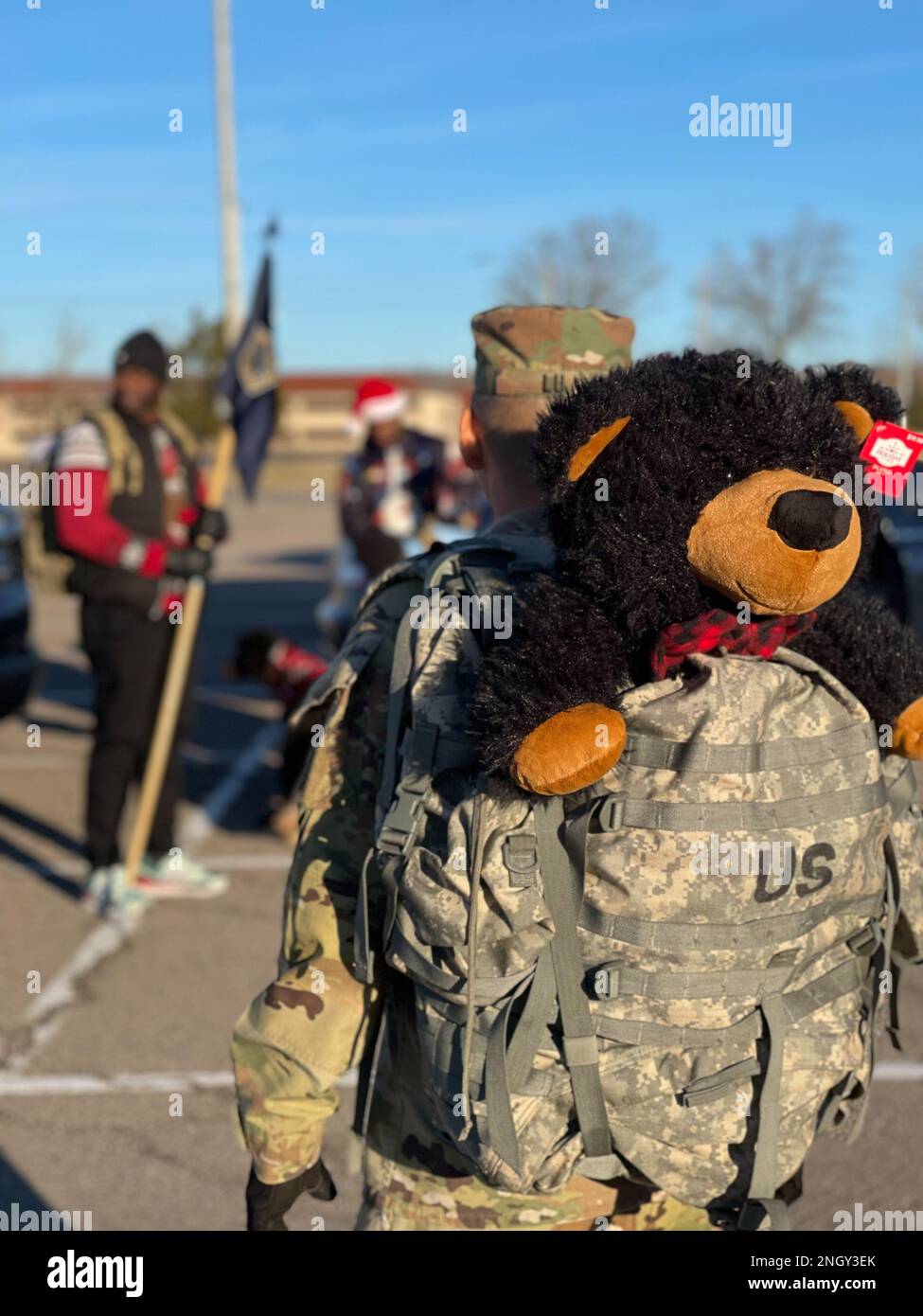 A teddy bear rides in the rucksack of Sgt. Maj. Nguyen Lu, U.S. Army ...