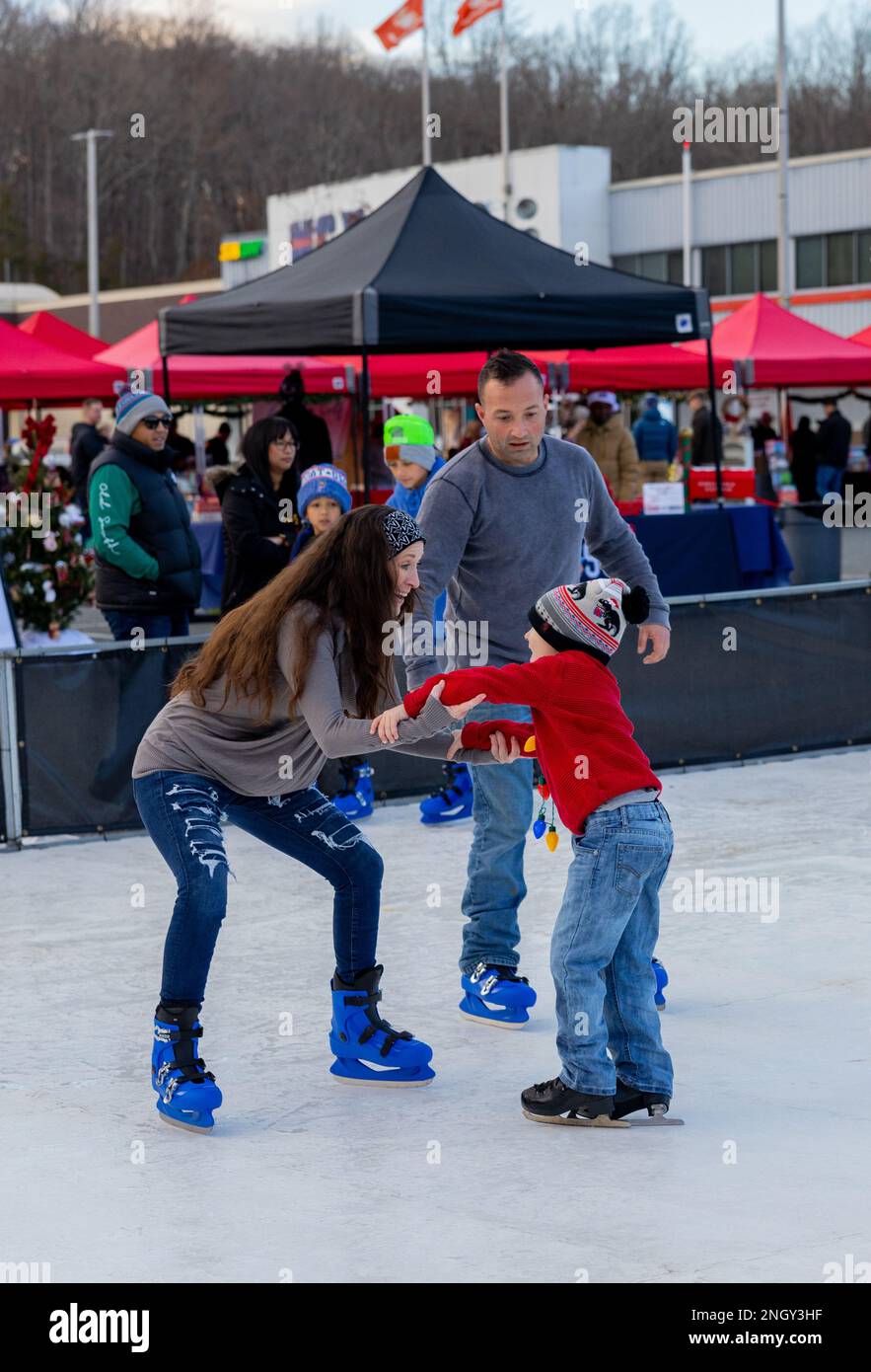 U.S. Marines and their families ice skate during the annual holiday ...