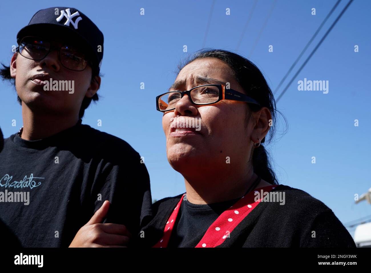 Gabriela Gil and her son, Daniel, pay their respects to Bishop David O ...