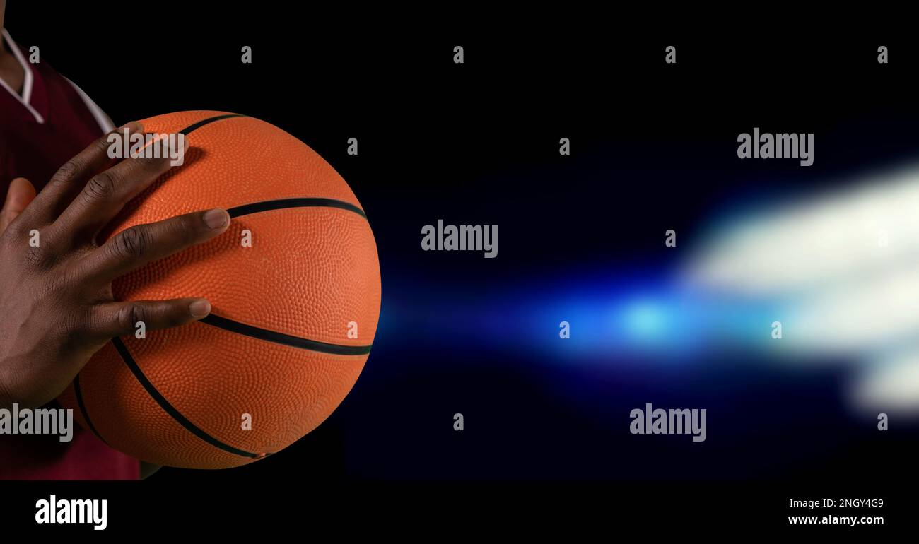 Composition of midsection of female basketball player with ball ...