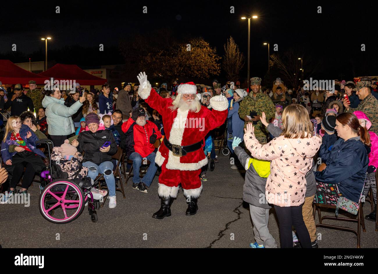 Santa walks through the crowd during the annual holiday tree lighting ...
