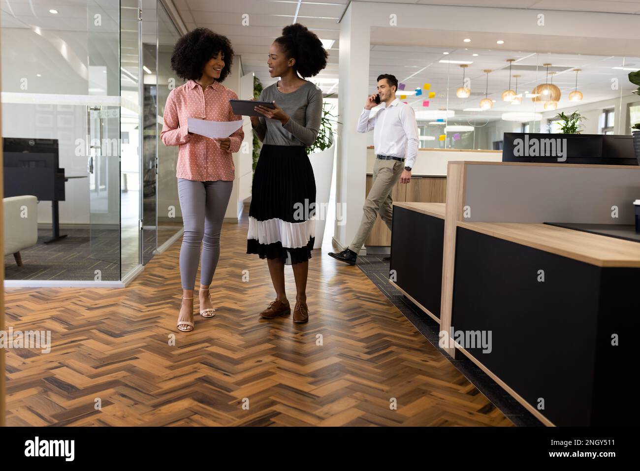 African american women with document walking in office Stock Photo - Alamy