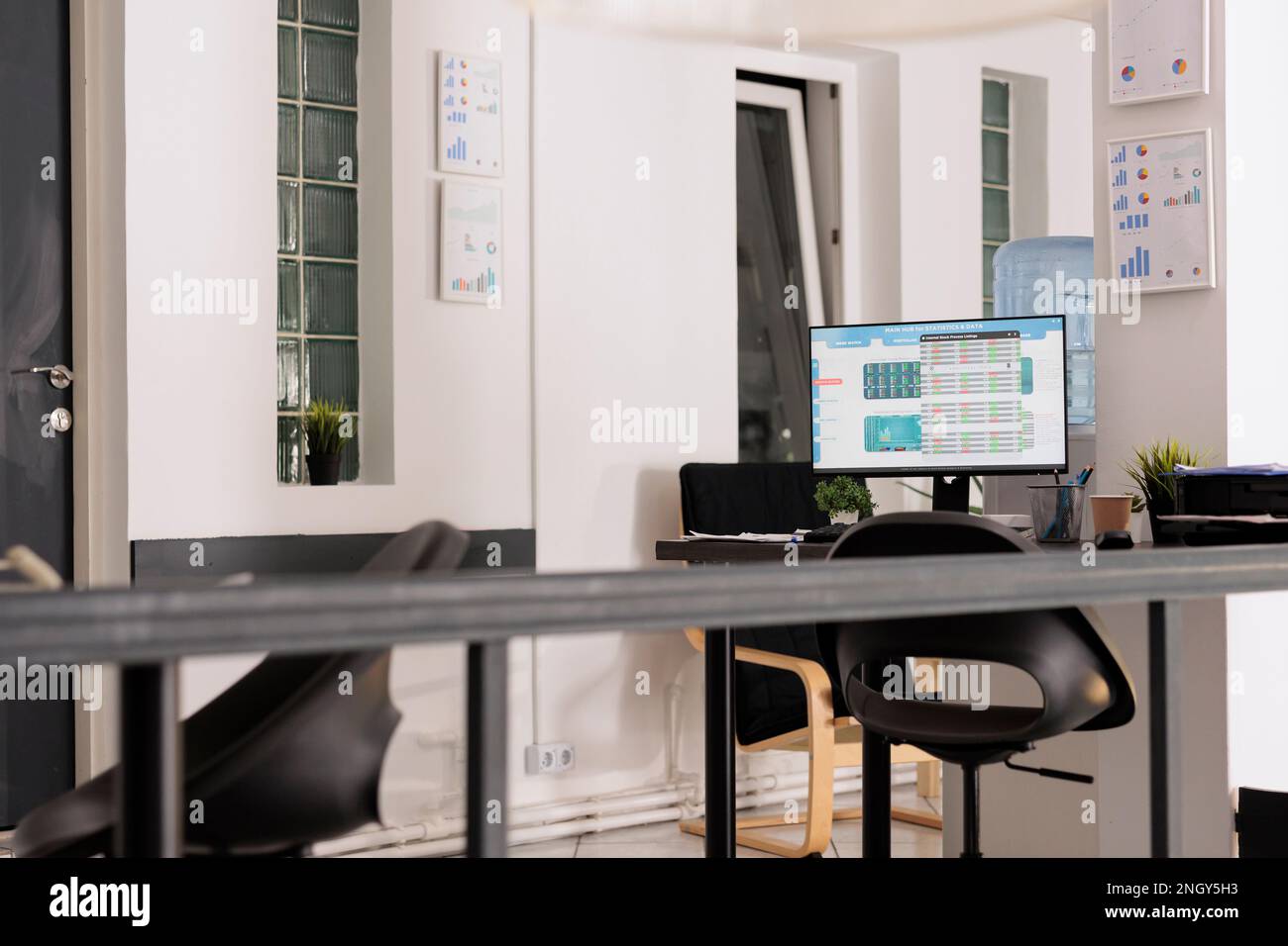 Financial sales report on the desktop computer monitor, printed charts ...