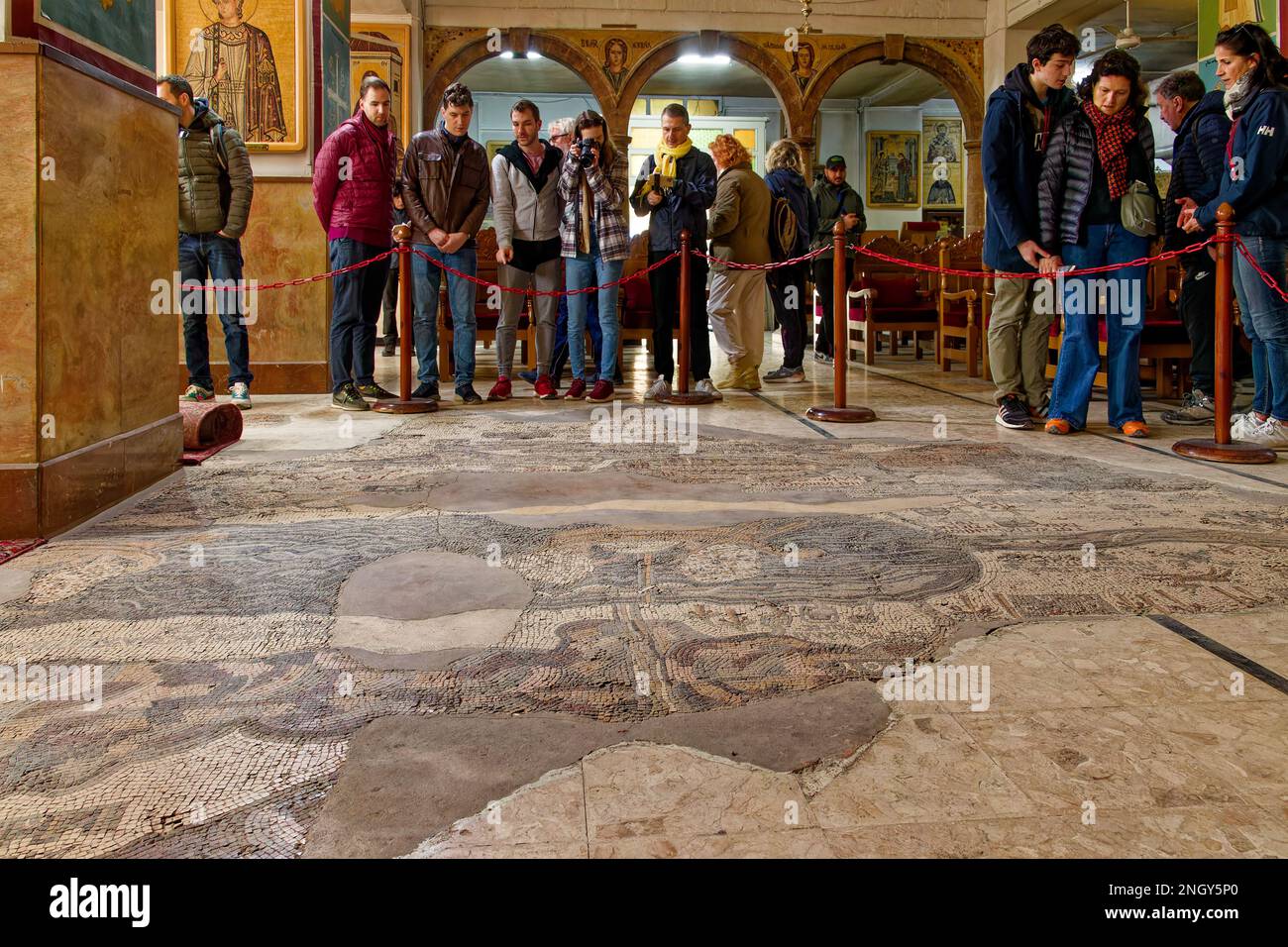 Tourists enjoy the mosaic map of the Holy Land inside the Greek ...