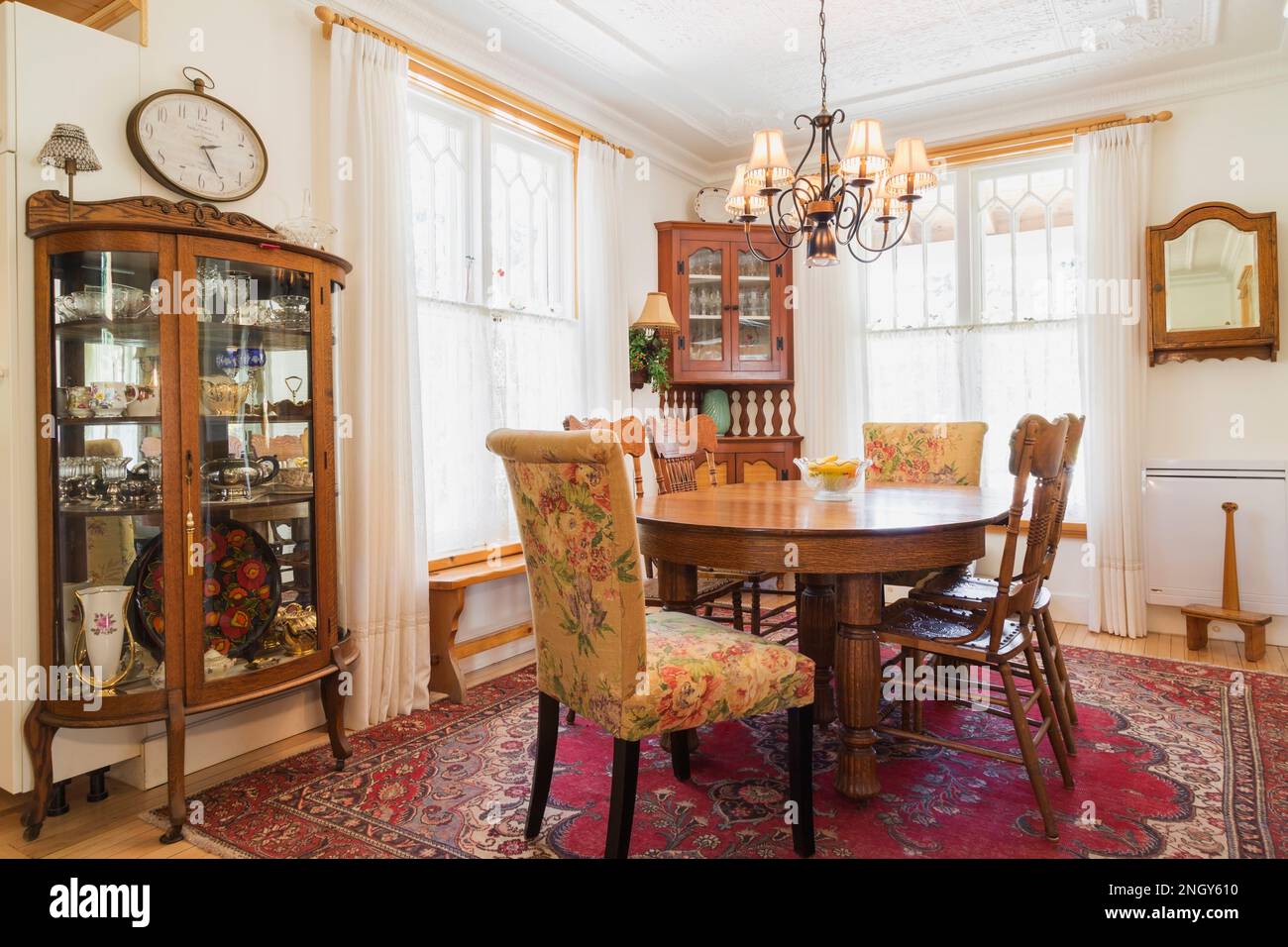 Oval oak wood dining table with press-back chairs, wood with glass ...