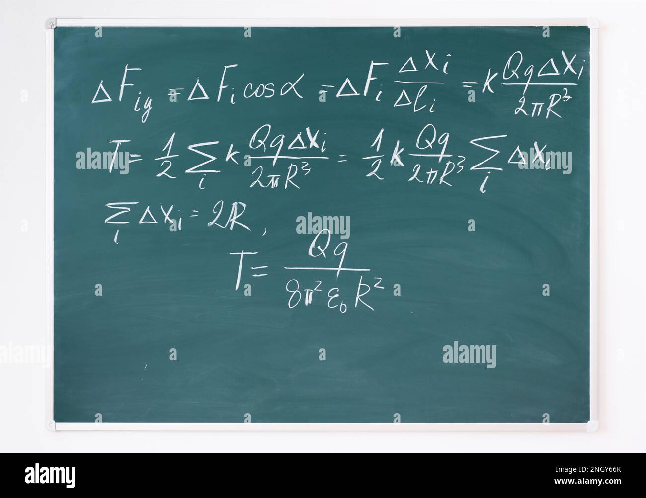 Equations written in chalk on blackboard Stock Photo - Alamy