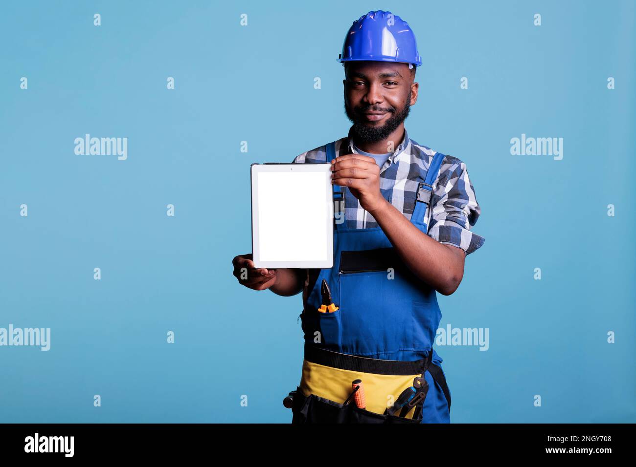 Portrait of contractor with digital tablet with empty white screen ...