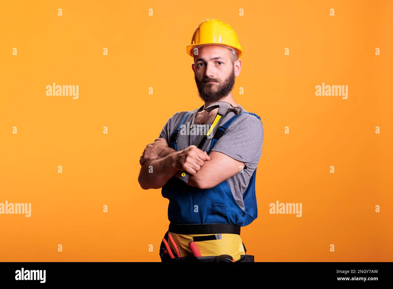 Craftsman engineer using hammer on renovation project, standing over ...
