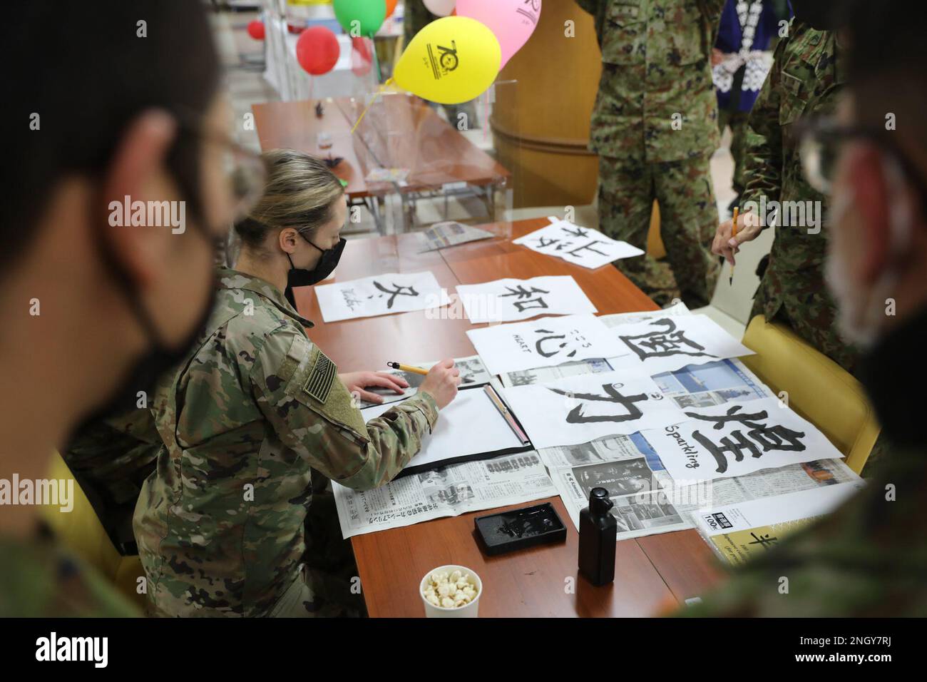 Members of the Yama Sakura exercise learn "kanji", traditional Japanese ...