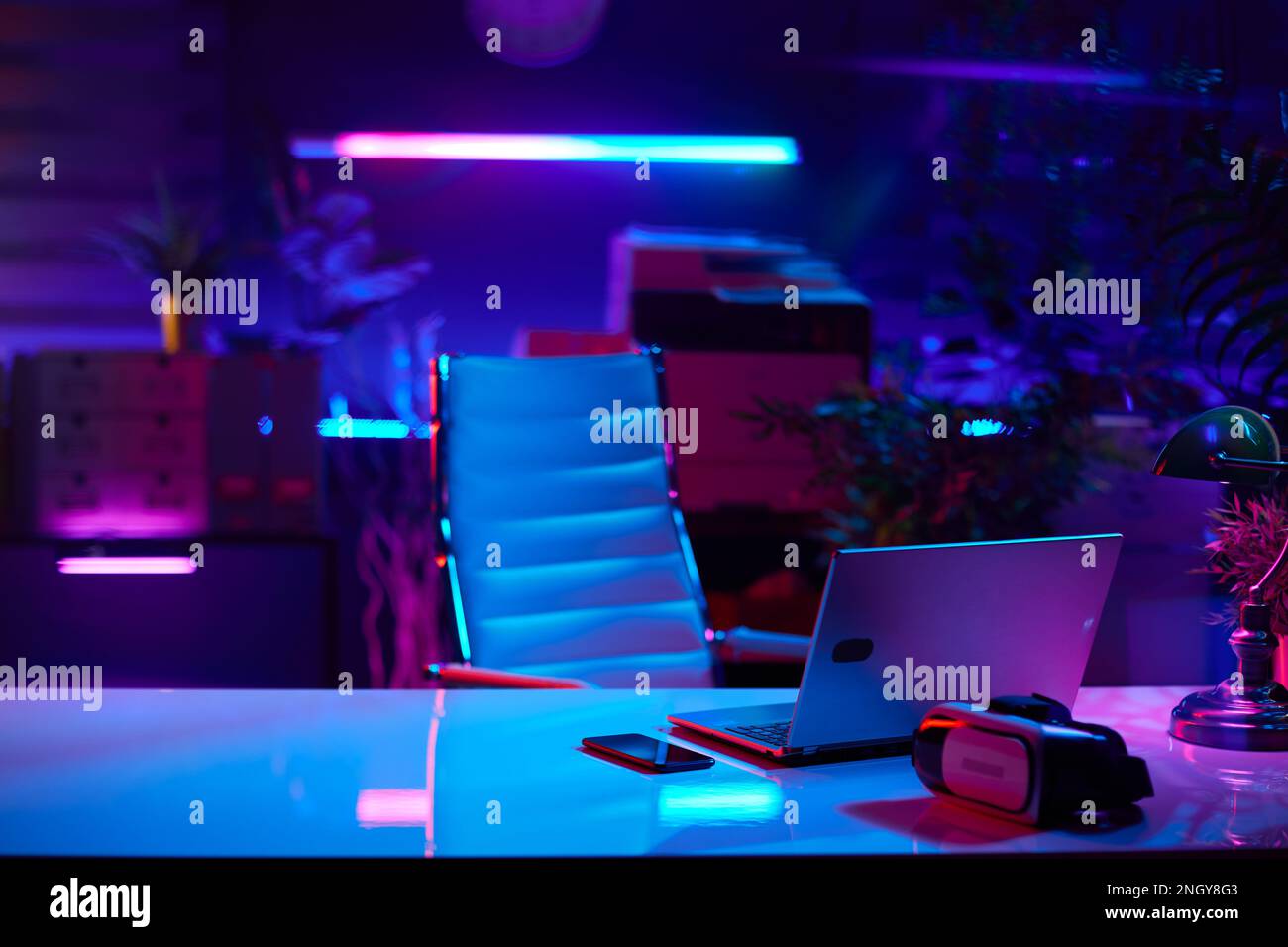 Neon metaverse futuristic concept. modern office with desk, laptop and ...