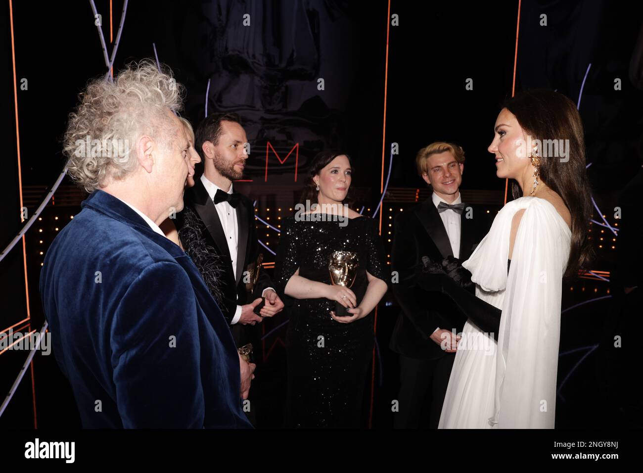 The Princess of Wales speaks to Charlie Mackesy (left), Peter Baynton ...