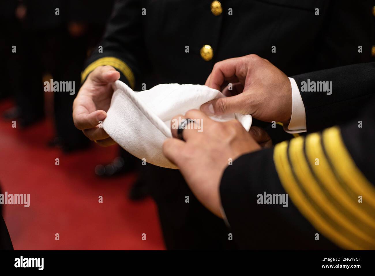 Individual uniform items are inspected during a service dress blue ...