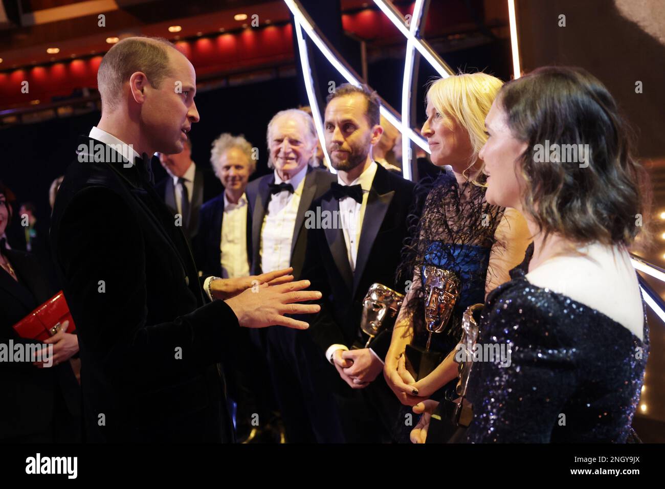 The Prince of Wales speaks to Peter Baynton (centre), Cara Speller ...