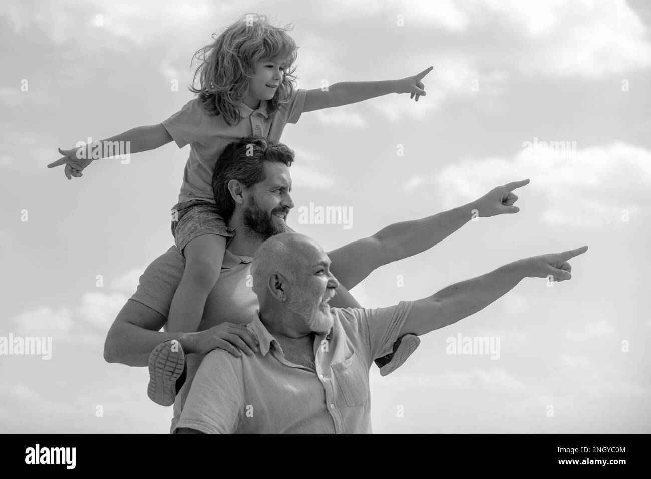 Family tree. Father and son with grandfather was excited with pointing ...