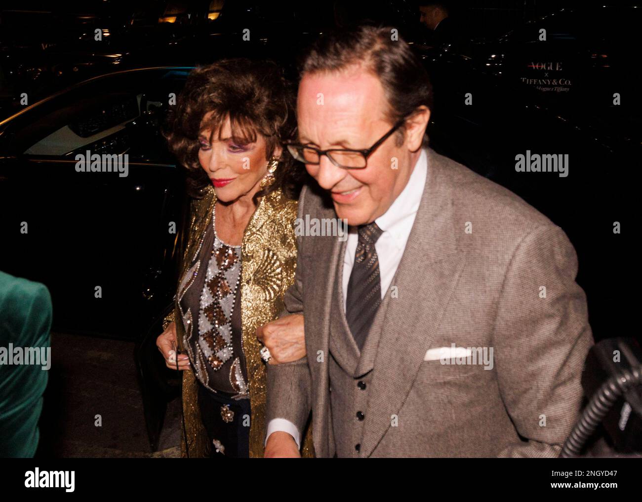 Dame Joan Collins and Percy Gibson attending the British Vogue and ...