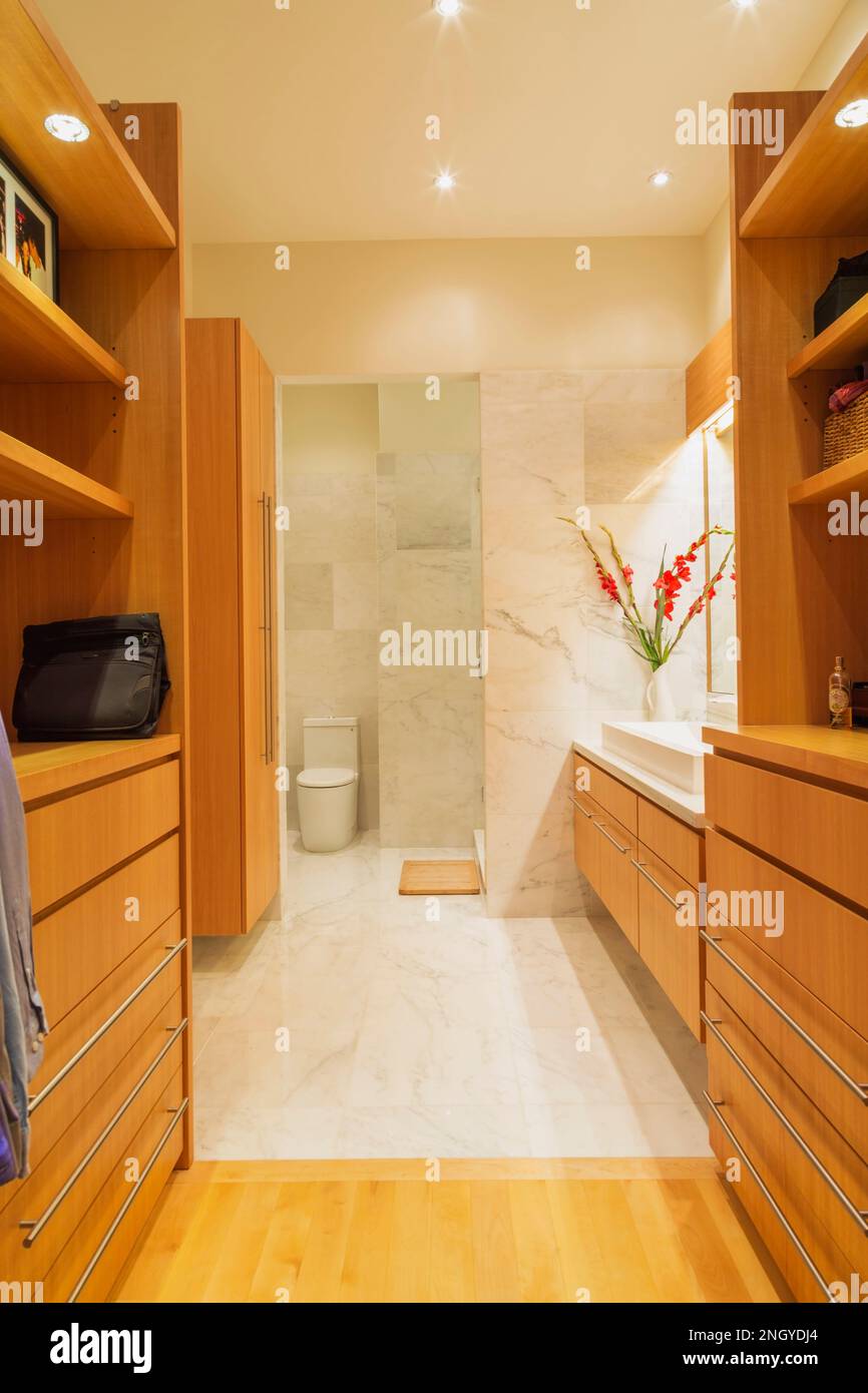 Douglas fir wood walk-in closet and cabinet with white marble ...