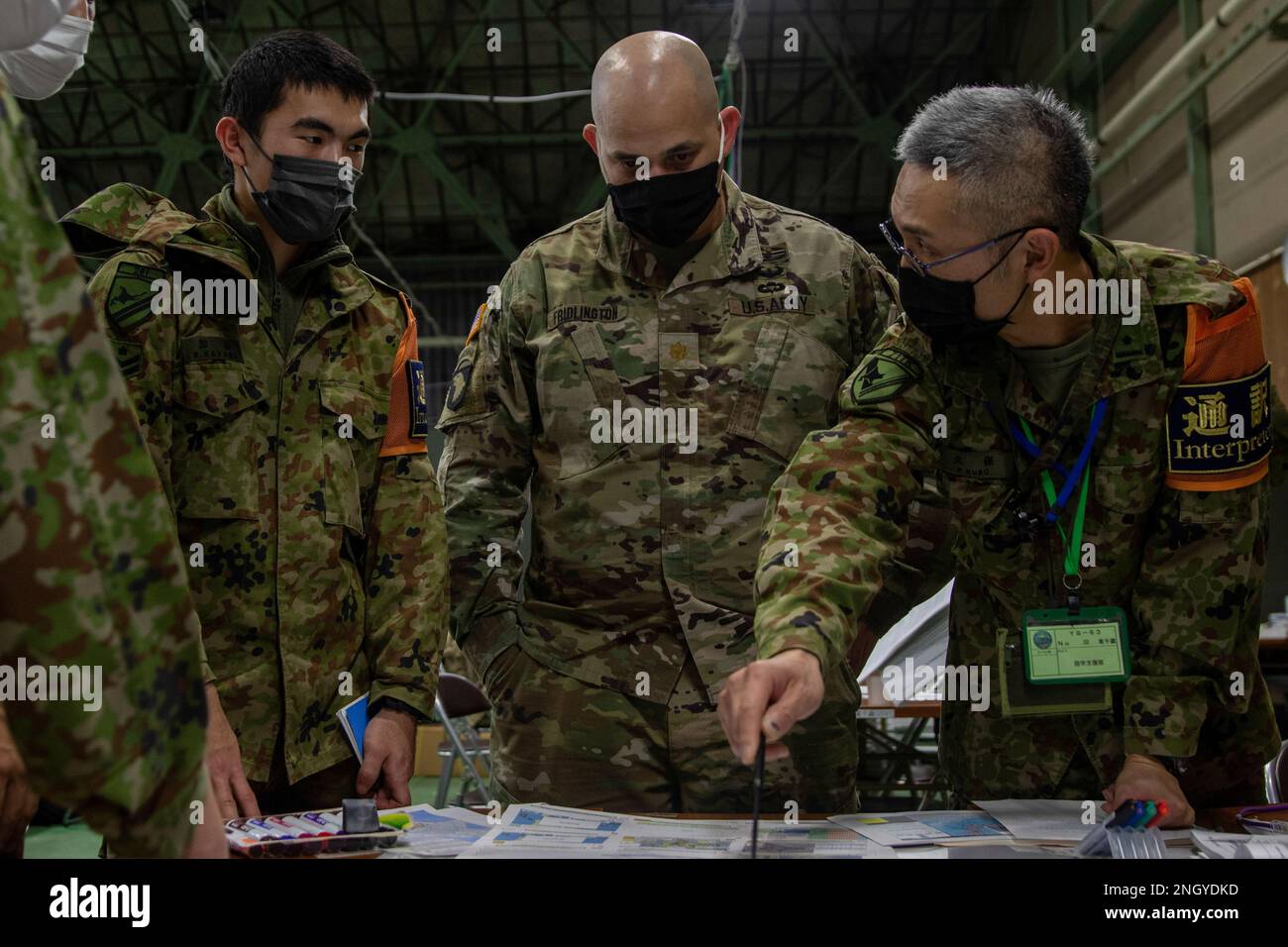 Soldiers assigned to 1st Brigade 11th Airborne Division, discuss plans ...
