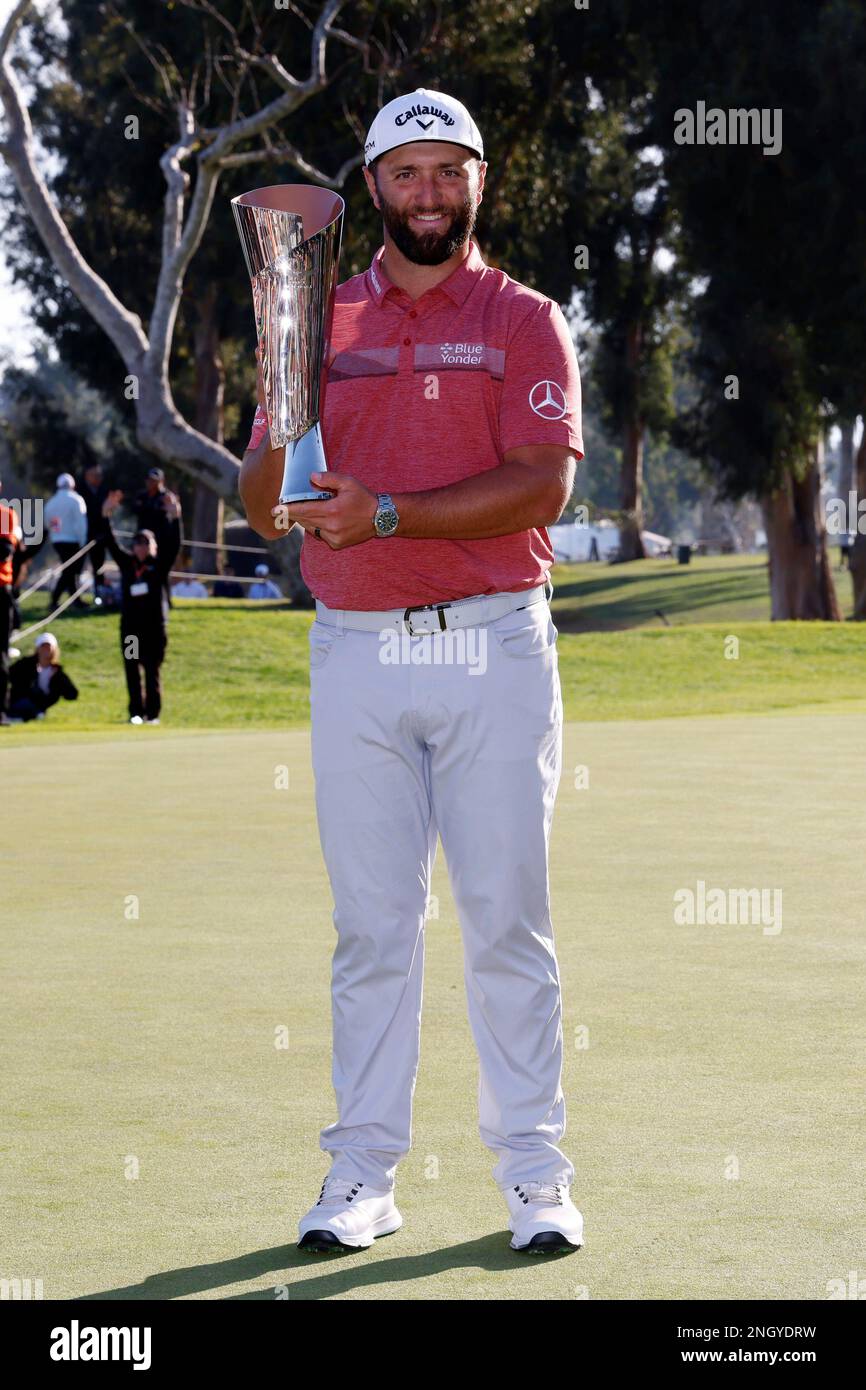 Jon Rahm hold the winner's trophy after winning the Genesis ...
