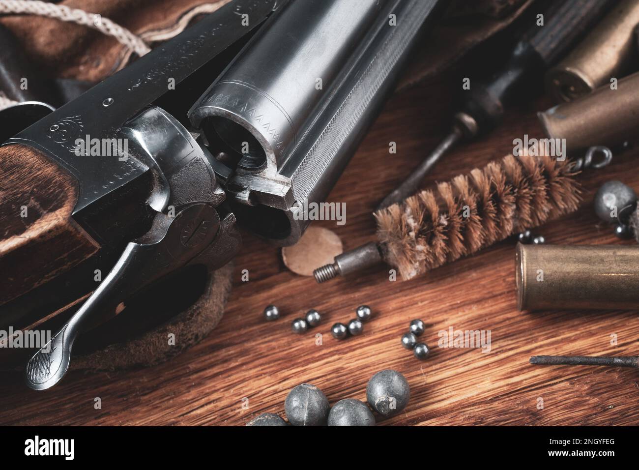 Antique 16-gauge break-action smooth-bored shotgun with brass cases and ...