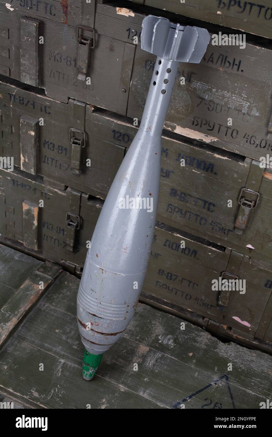Soviet or russian 120 mm mortar shell on army green crate. Text in ...
