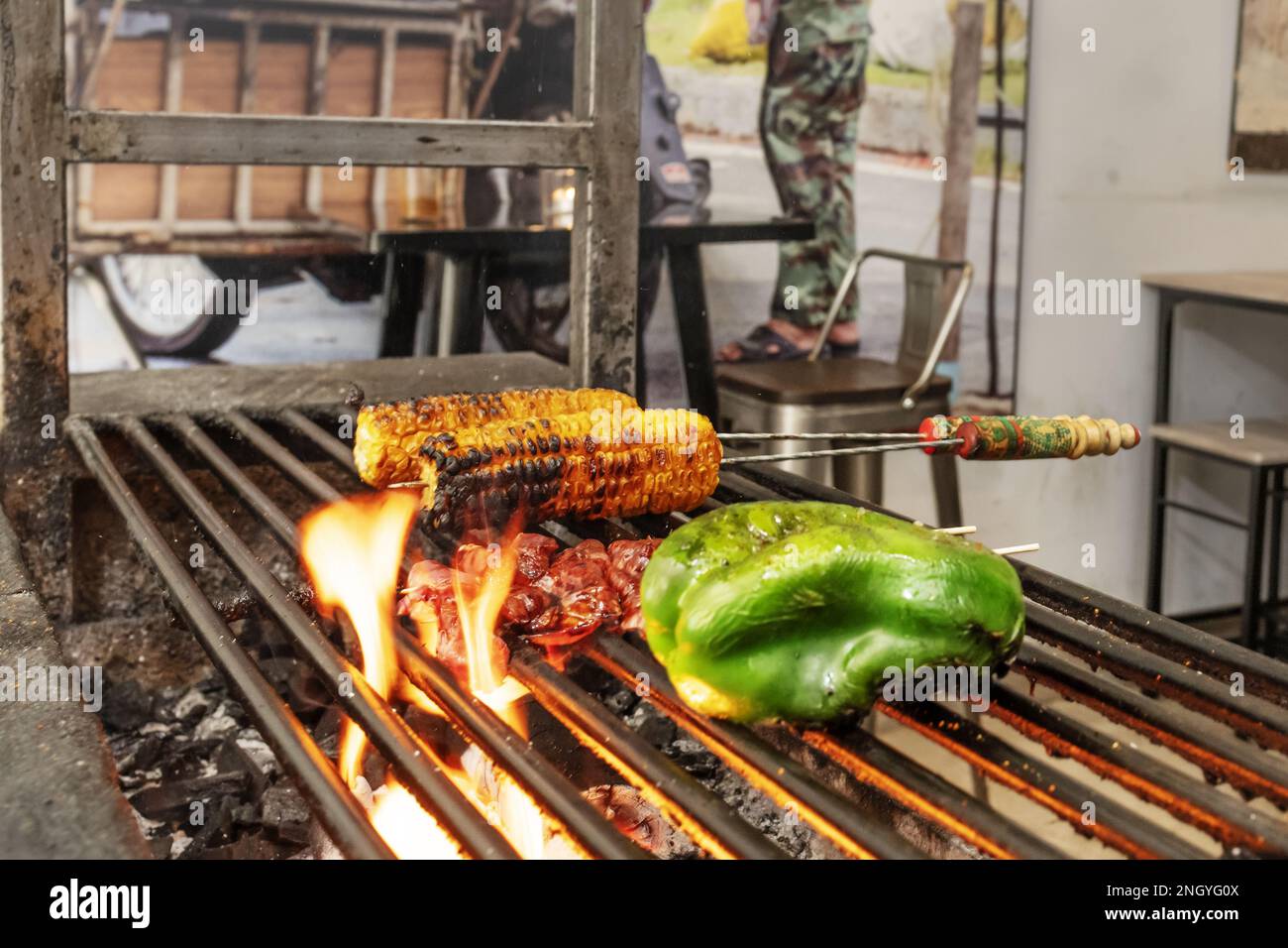 Woman cooking over grill hi-res stock photography and images - Alamy