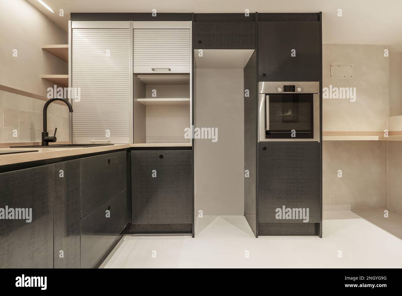 Kitchen with green furniture, black handles, cabinet with aluminum ...