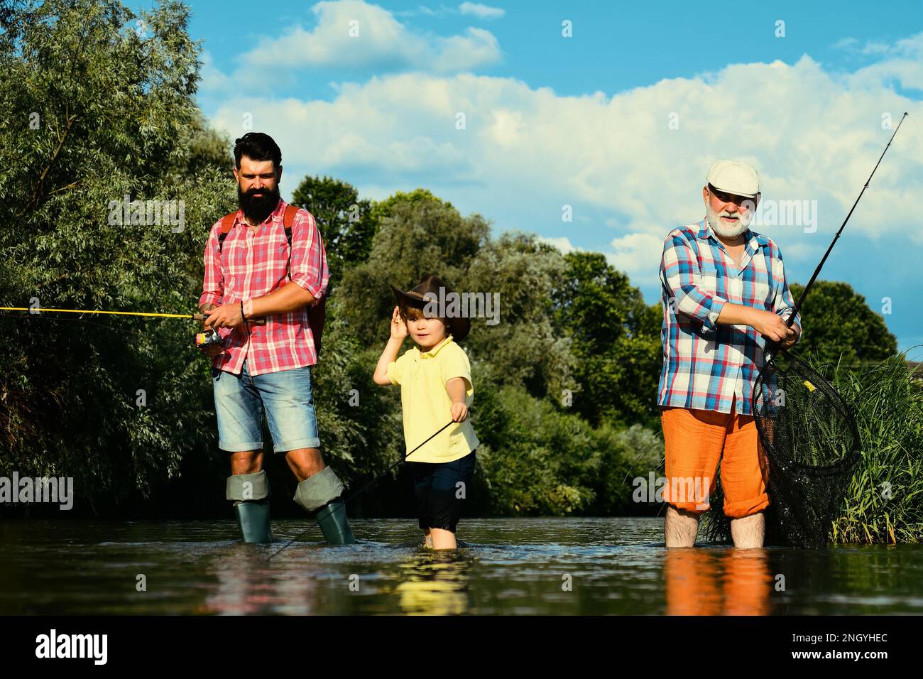 Fishing. Little boy fly fishing on a lake with his father and ...