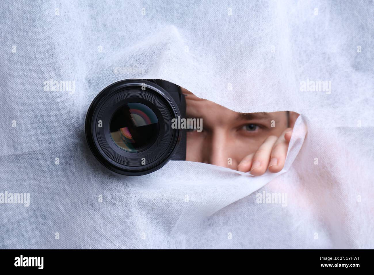 Man with face hidden with camera hi-res stock photography and images ...