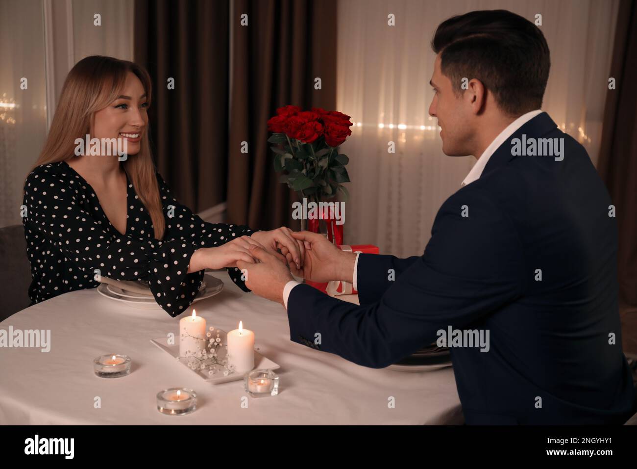 Lovely couple having romantic dinner in restaurant Stock Photo - Alamy