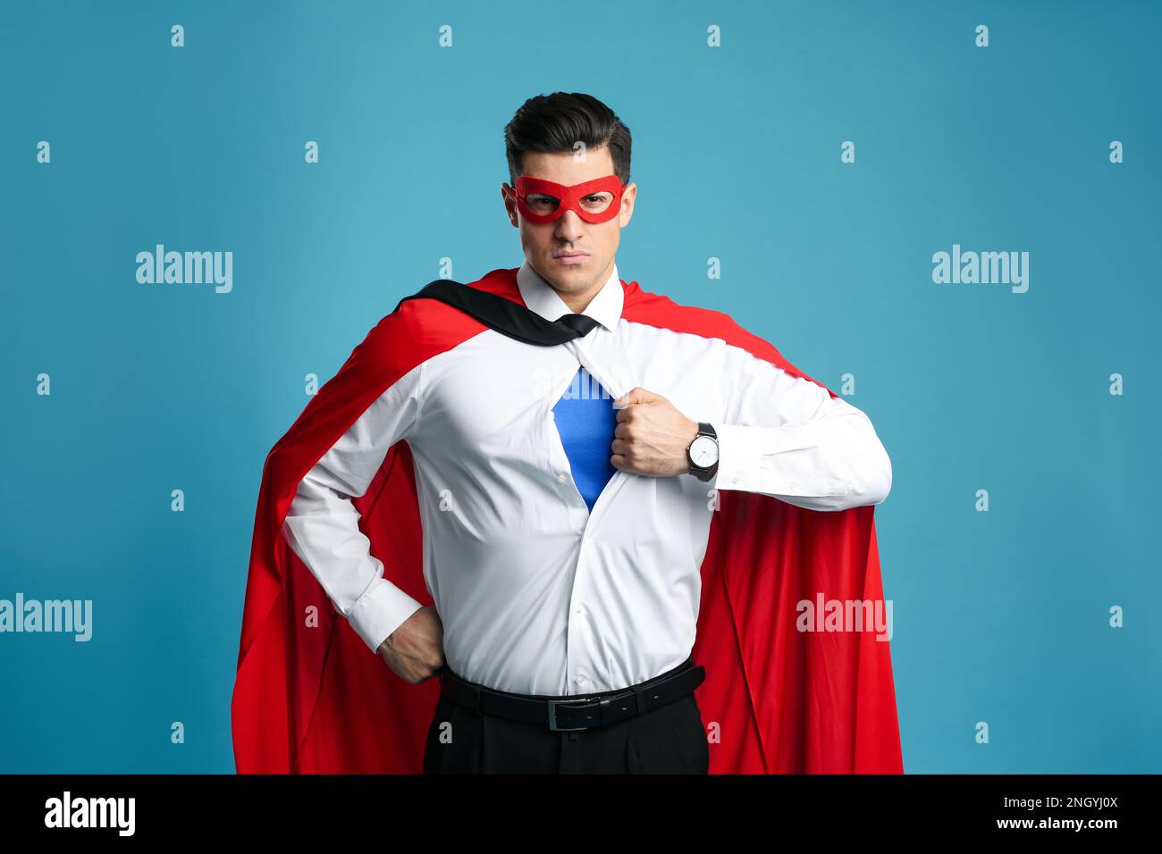 Portrait man taking off blue hi-res stock photography and images - Alamy