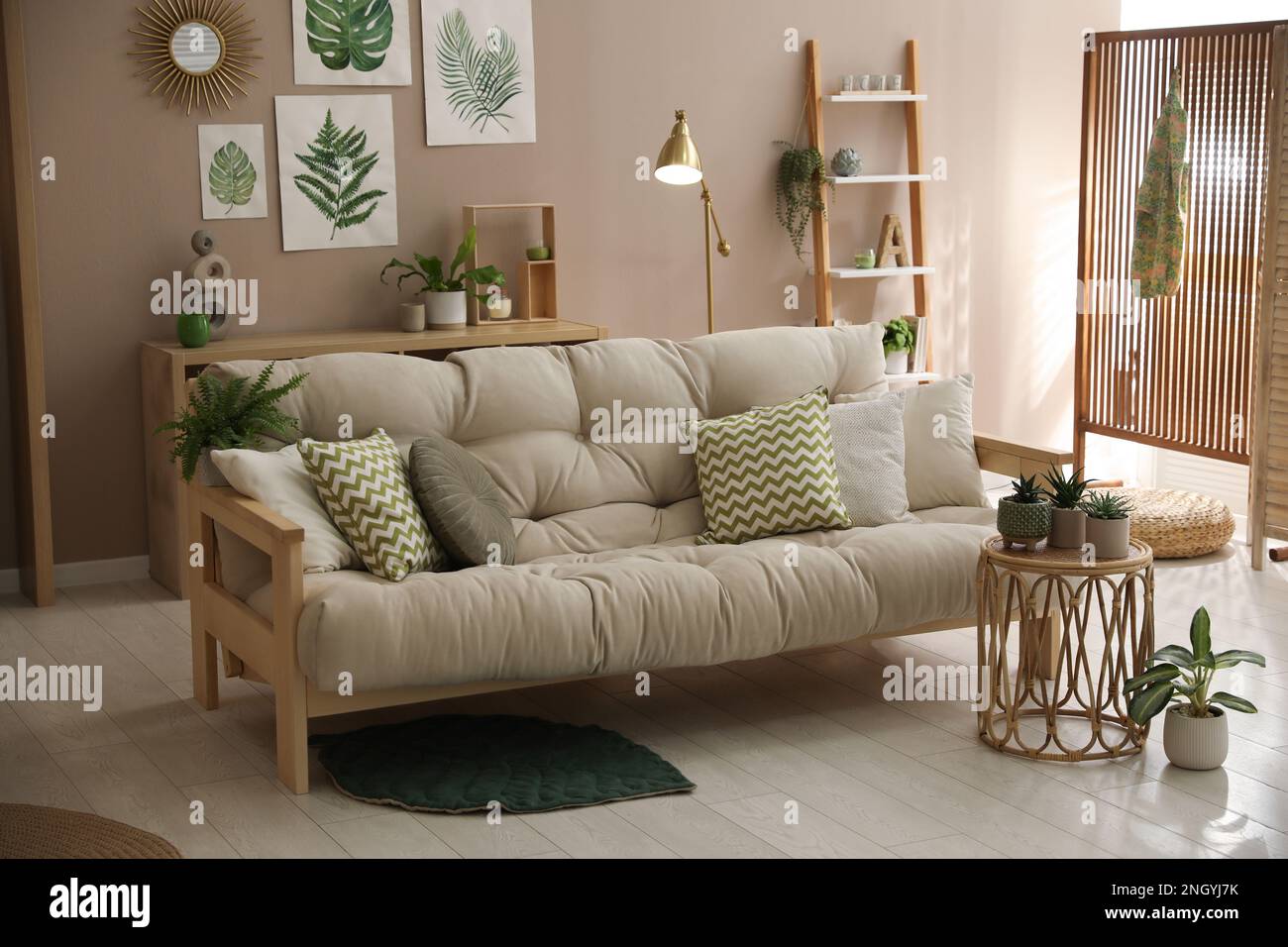 Stylish living room interior with comfortable sofa and beautiful ...