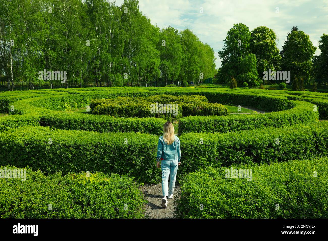 Woman in the maze hi-res stock photography and images - Alamy